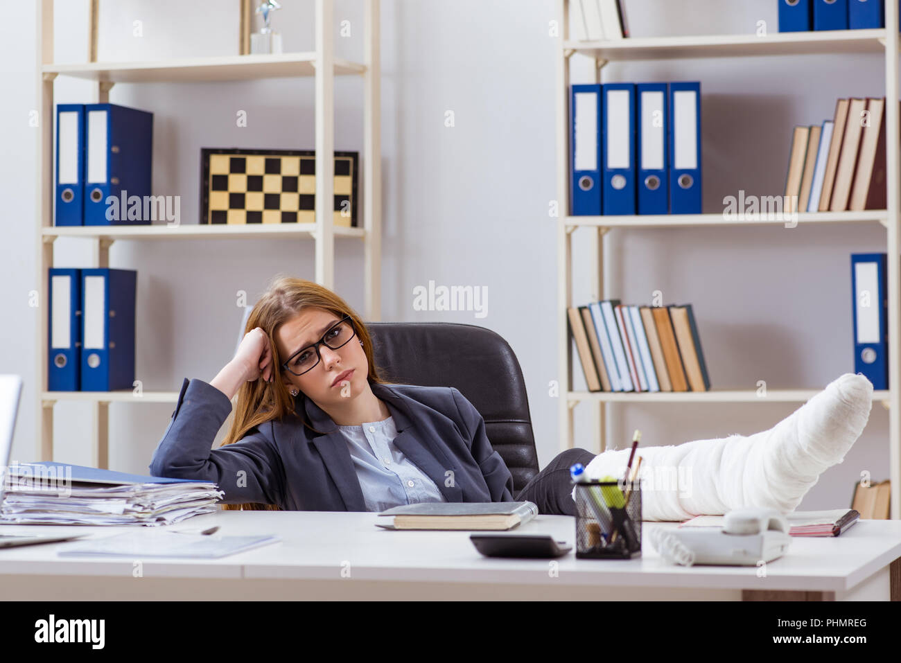 Busiesswoman employee with broken leg in office Stock Photo - Alamy