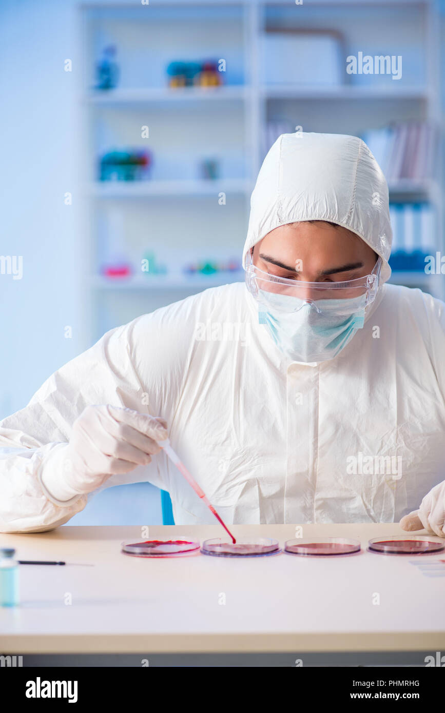 Lab assistant testing blood samples in hospital Stock Photo - Alamy