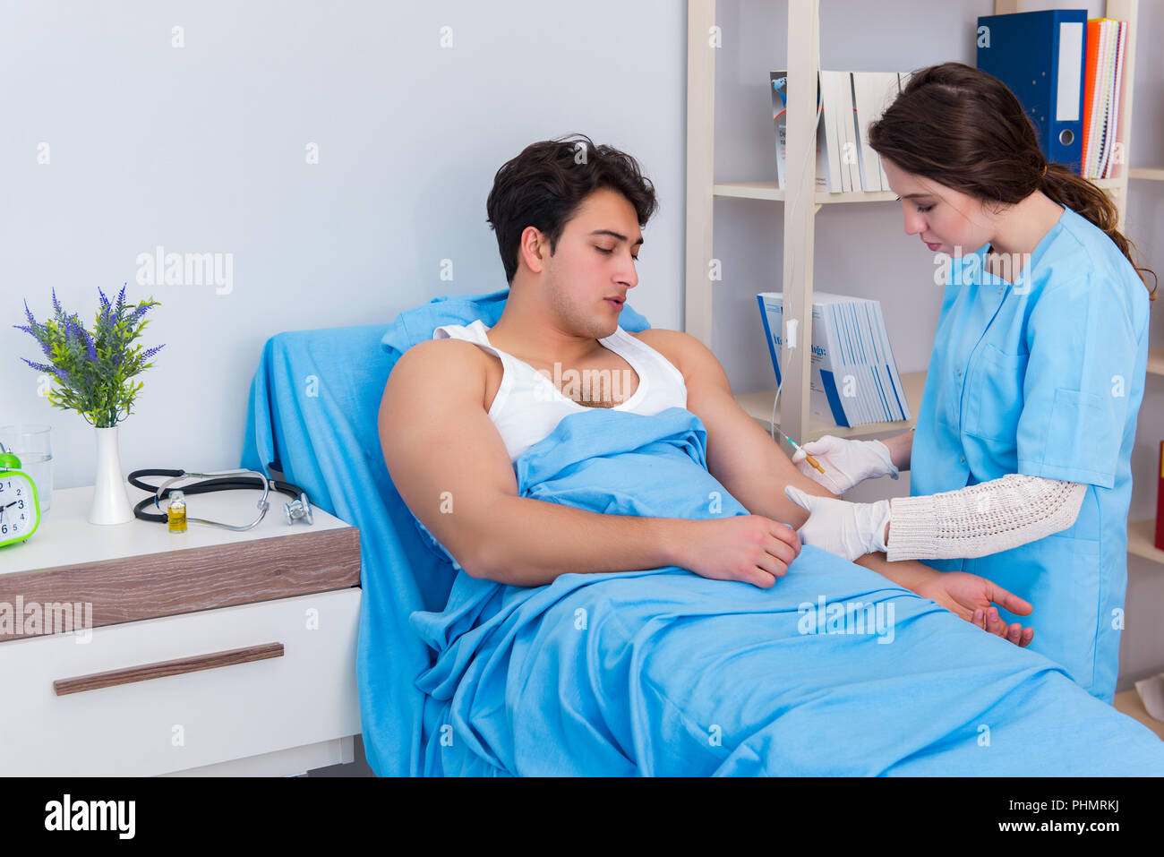 Doctor doing medical injection in hospital room Stock Photo - Alamy