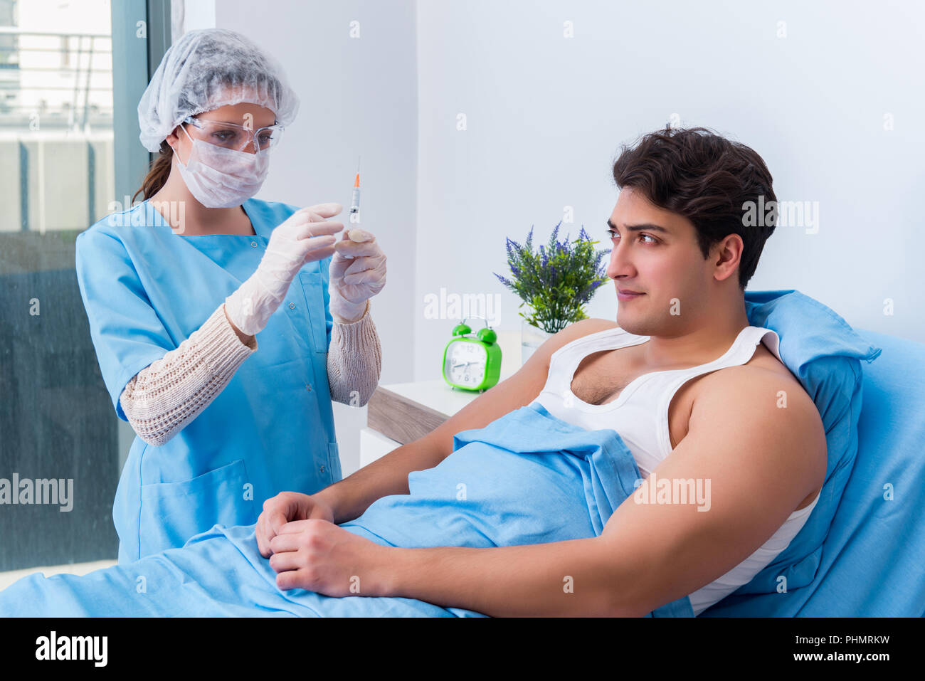 Doctor doing medical injection in hospital room Stock Photo - Alamy