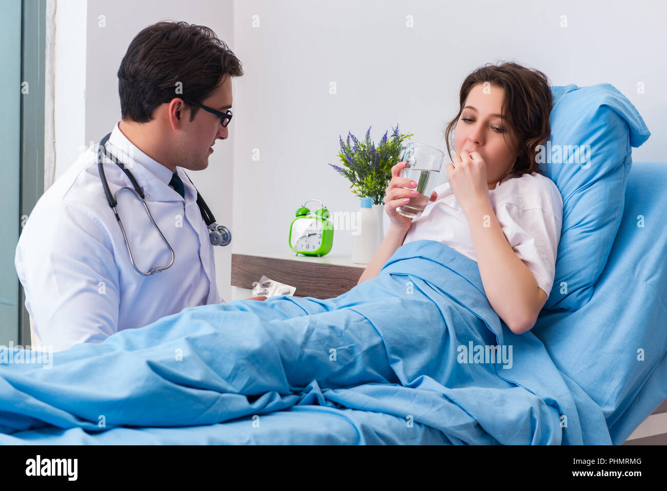 Doctor visiting patient in hospital room Stock Photo - Alamy
