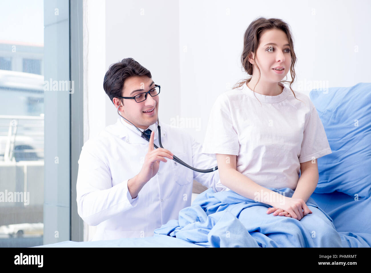 Doctor visiting patient in hospital room Stock Photo - Alamy