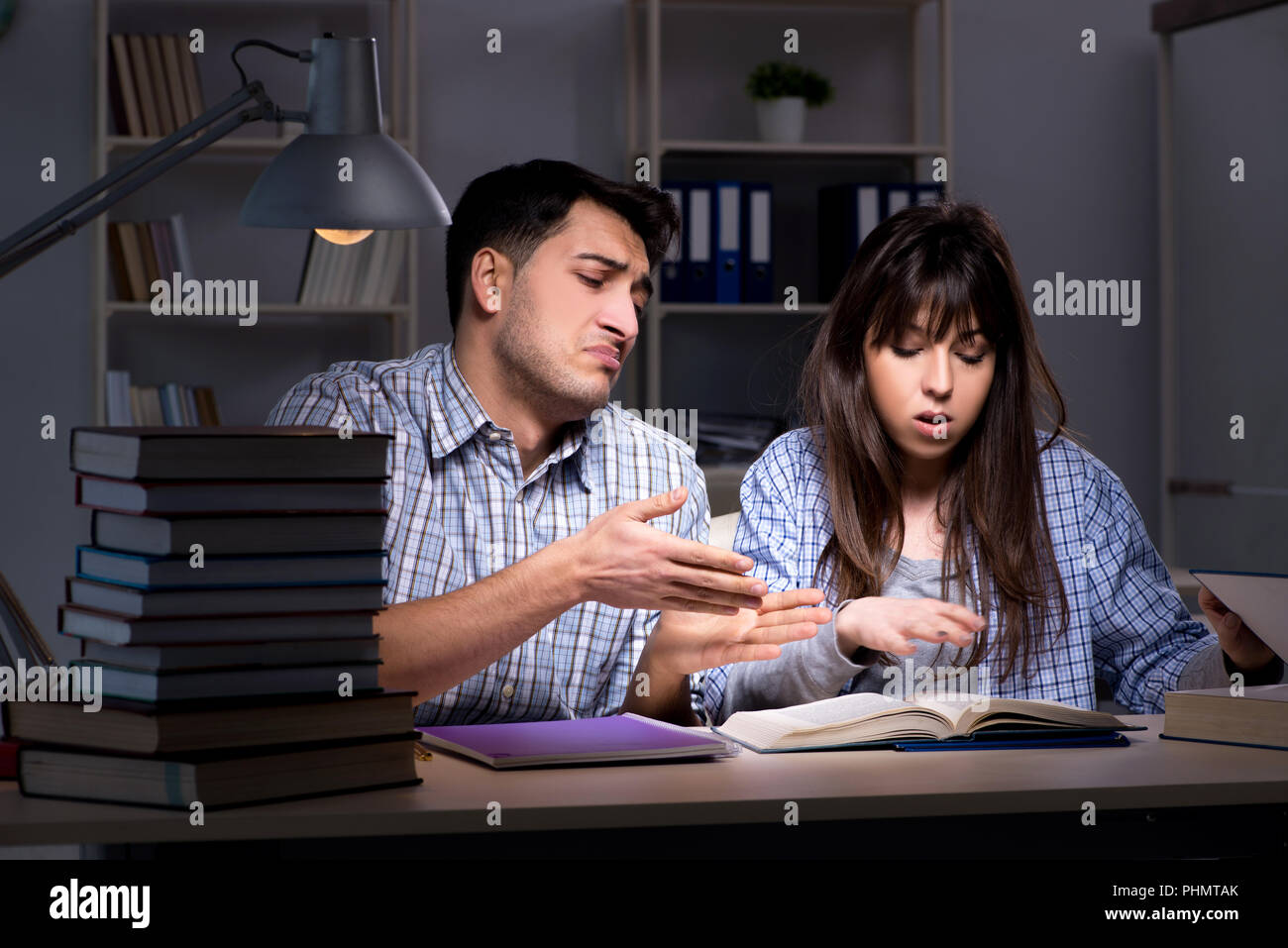 Two students studying late at night Stock Photo - Alamy