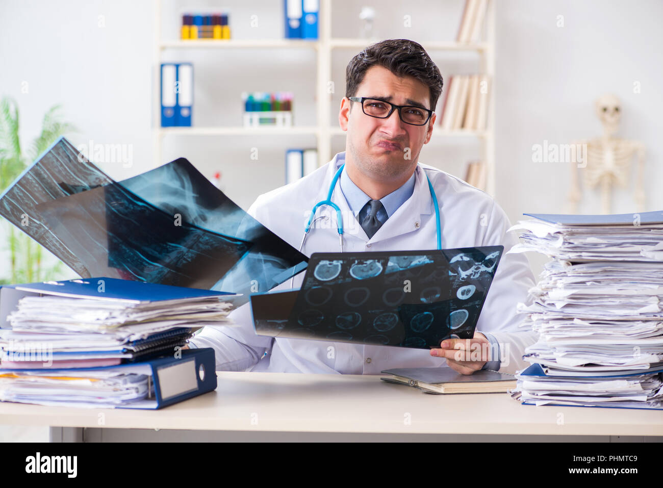Tired radiologist with x-ray image in hospital Stock Photo - Alamy