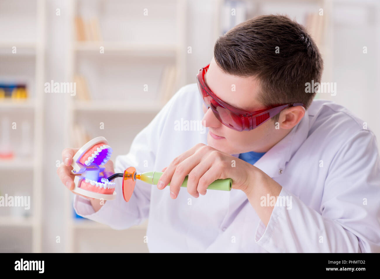 Dentist working teeth implant in medical lab Stock Photo - Alamy