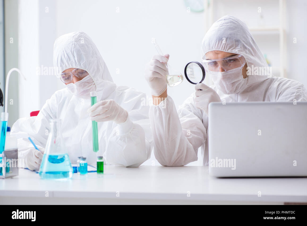 Scientists magnifying glass microscope hi-res stock photography and ...