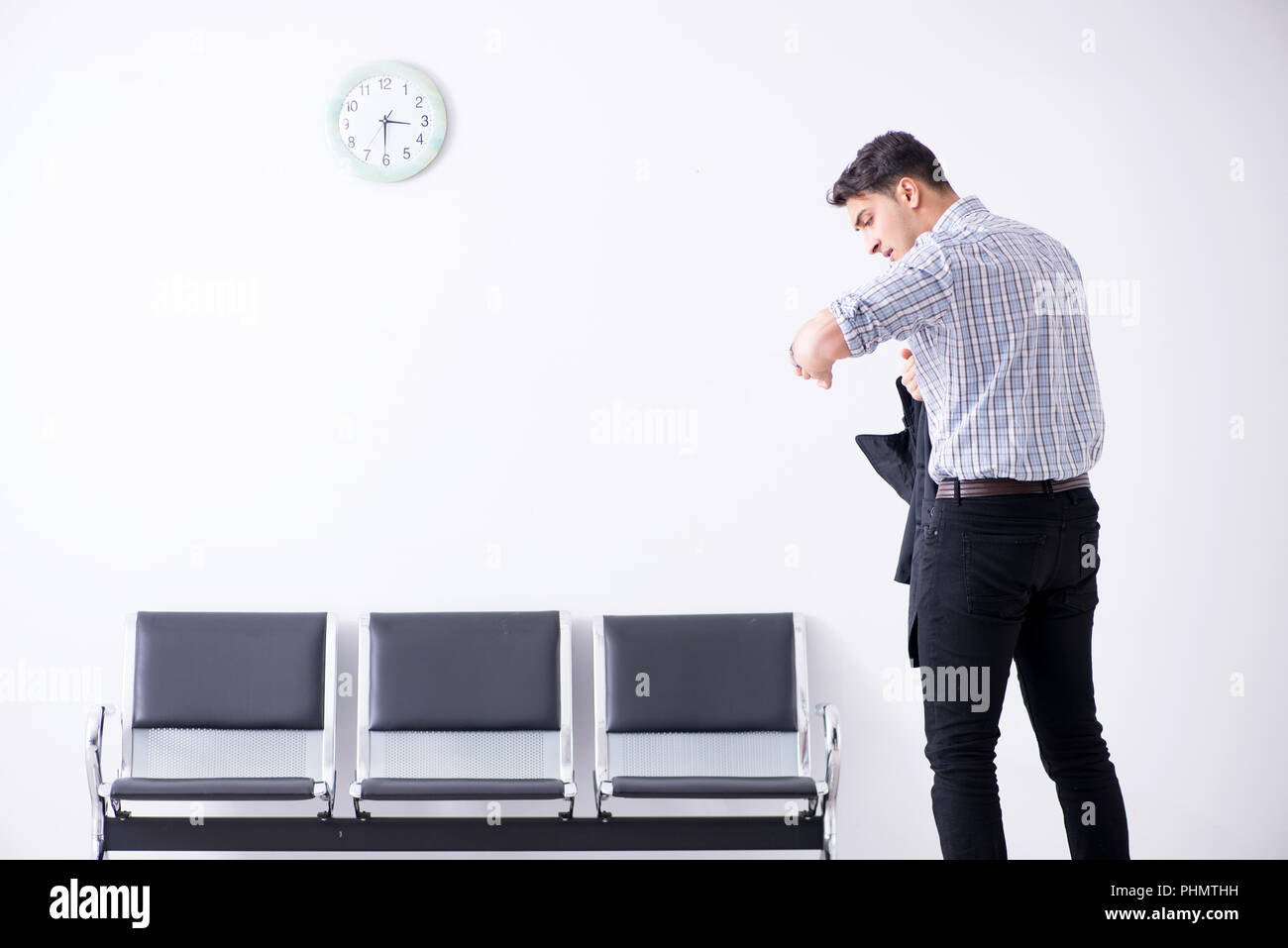 Man nervously impatiently waiting in the lobby Stock Photo - Alamy