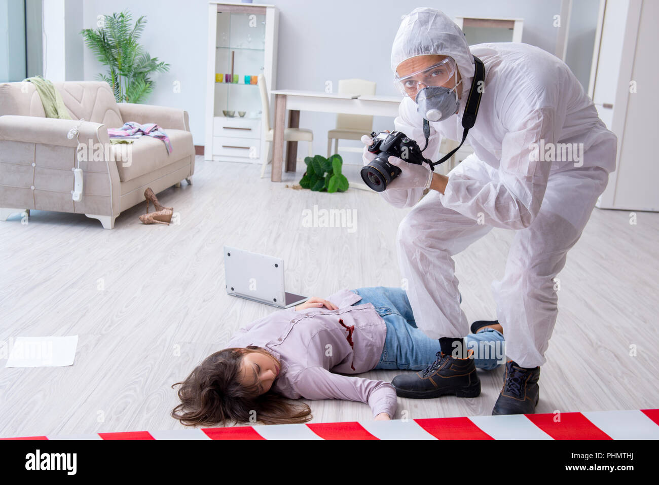 Forensic Investigator At The Crime Scene Investigating Woman Mur Stock