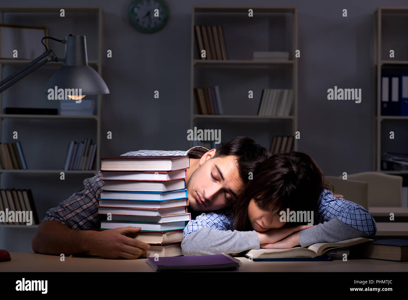Two students studying late at night Stock Photo - Alamy