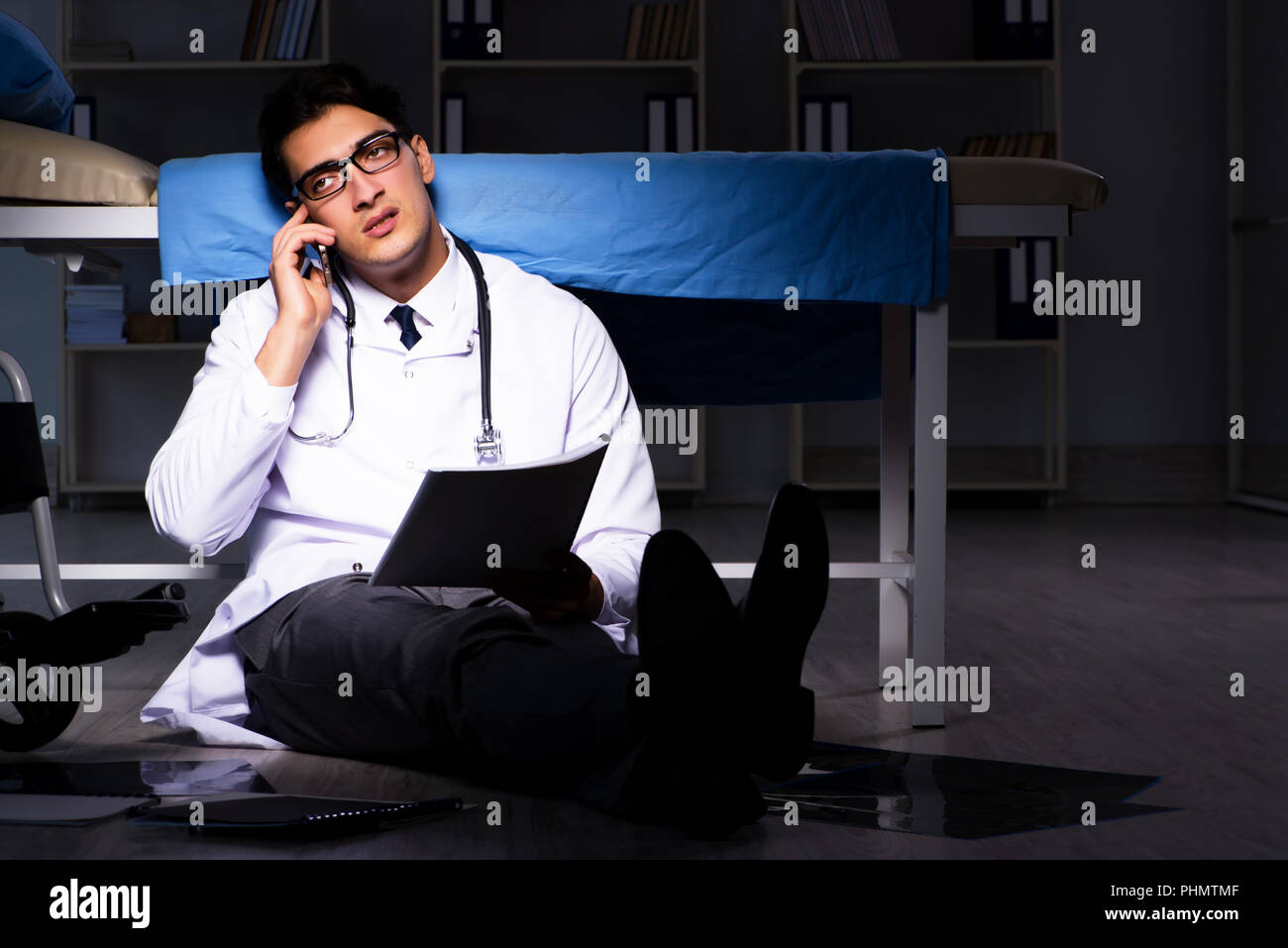 Doctor working night shift in hospital after long hours Stock Photo - Alamy