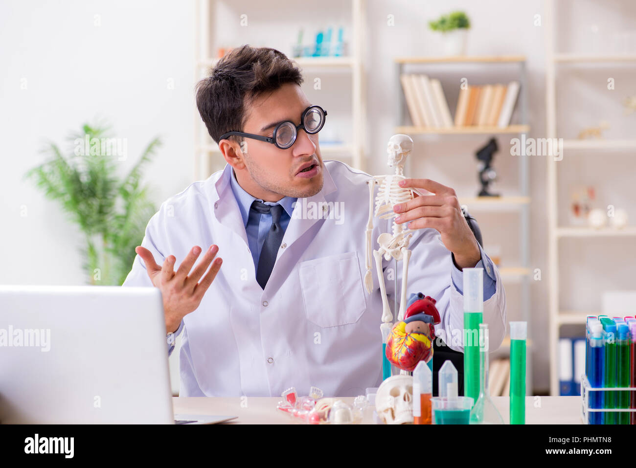 Funny doctor having fun in hospital lab Stock Photo - Alamy