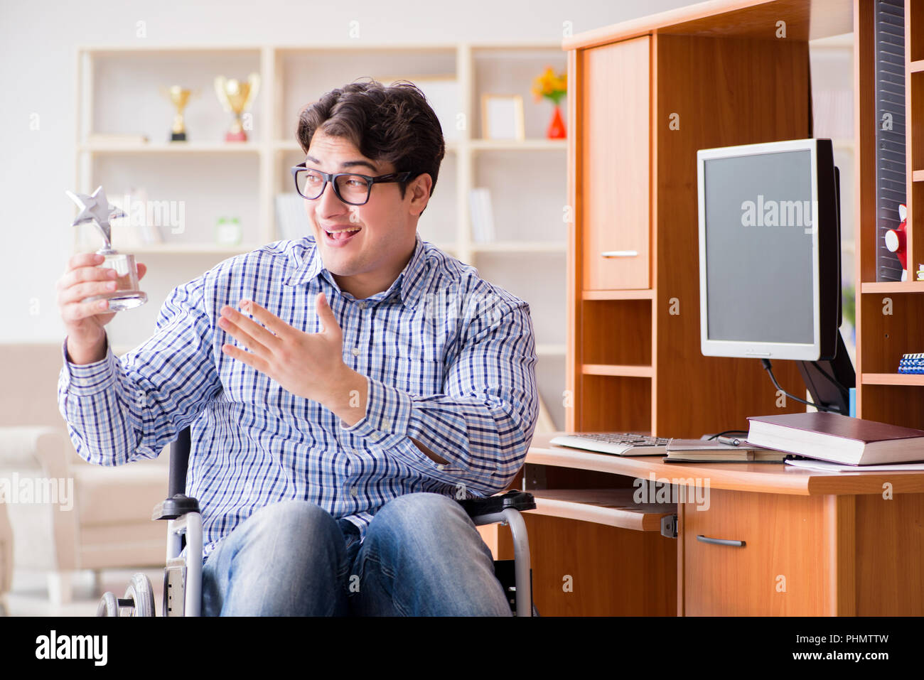 Disabled student studying at home on wheelchair Stock Photo - Alamy