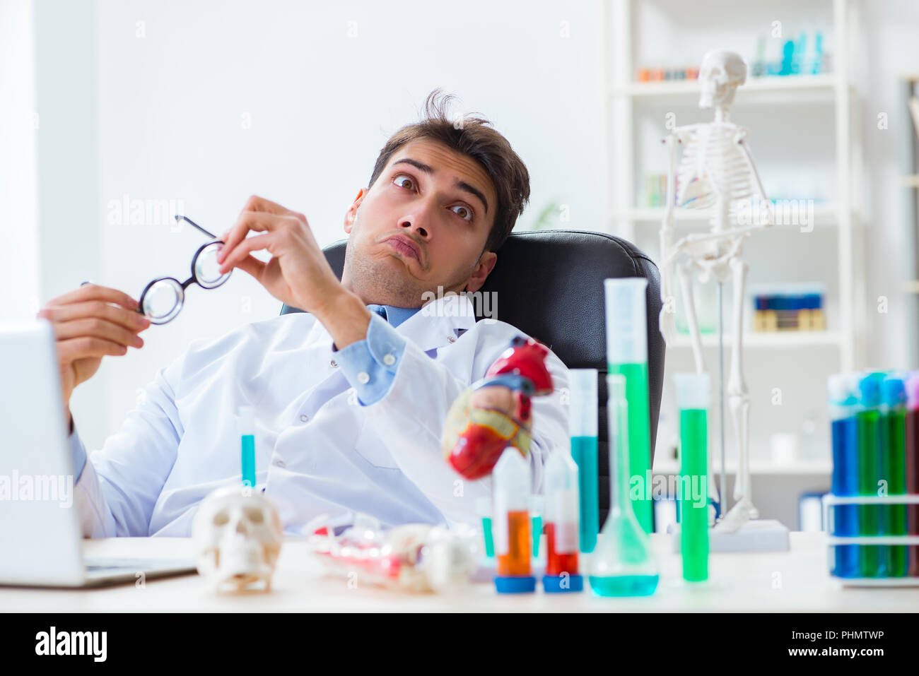 Funny doctor having fun in hospital lab Stock Photo - Alamy
