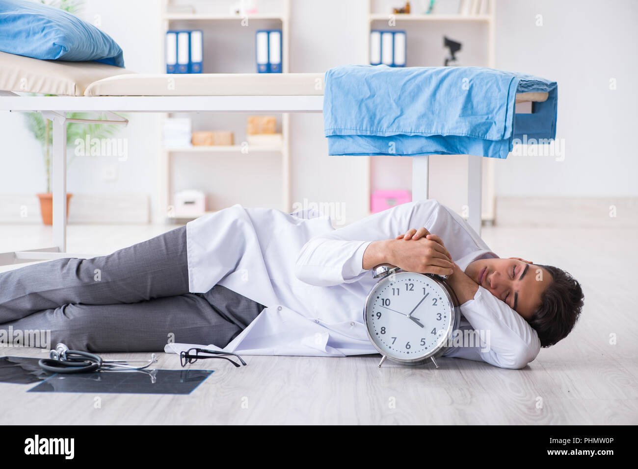 Sleepy doctor tired after long night shift Stock Photo - Alamy