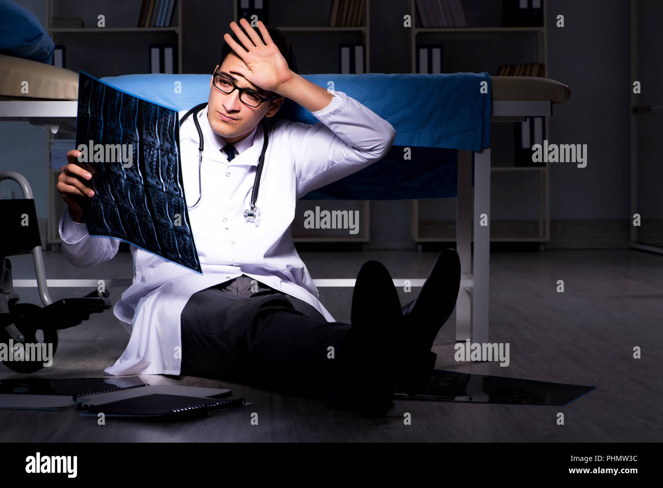 Doctor working night shift in hospital after long hours Stock Photo - Alamy