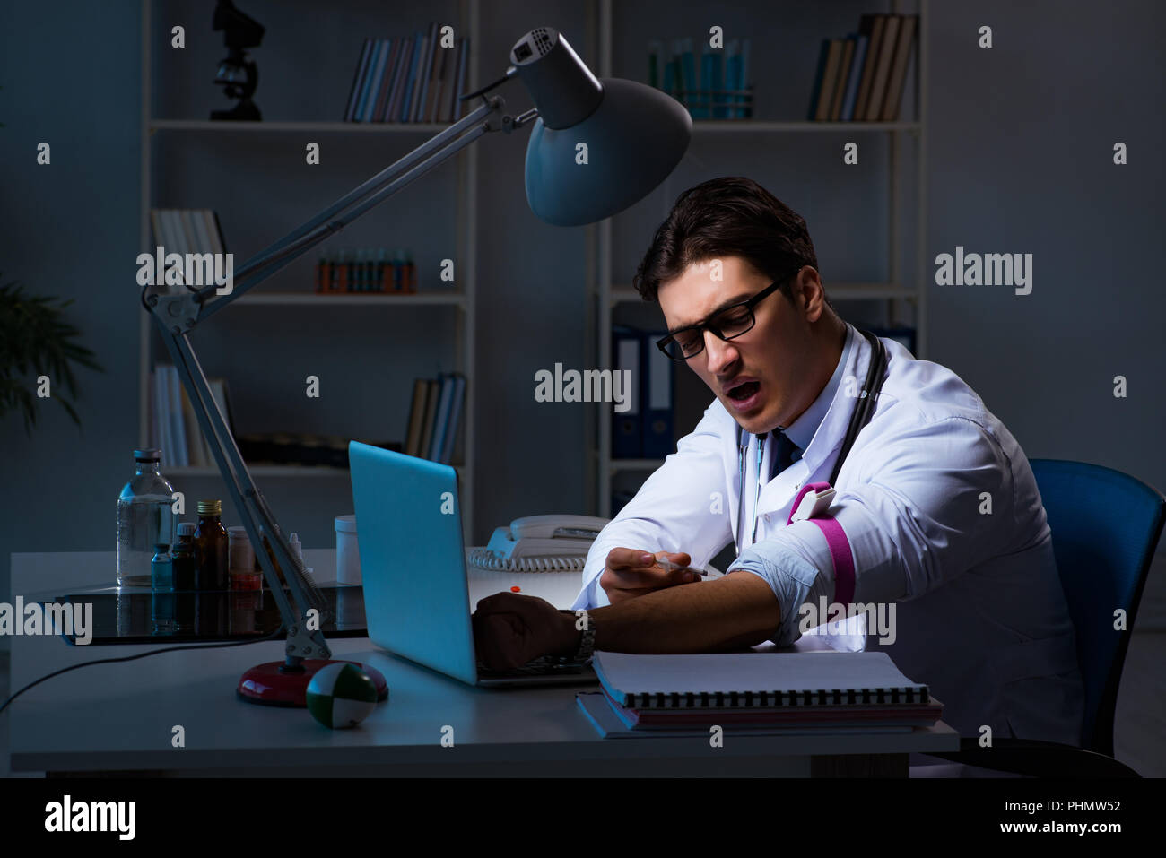 Doctor drug addict staying late on hospital Stock Photo - Alamy