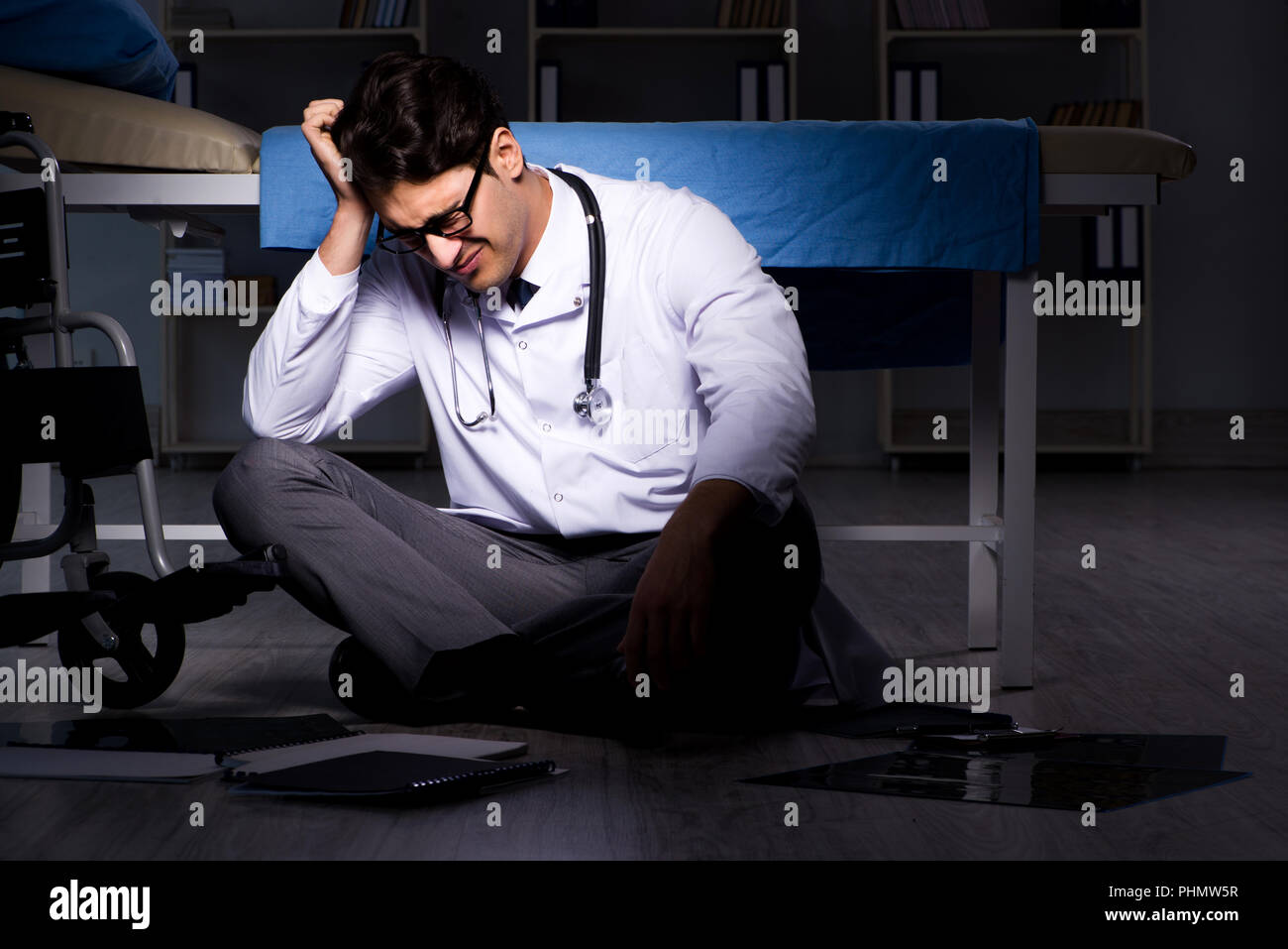 Doctor working night shift in hospital after long hours Stock Photo - Alamy