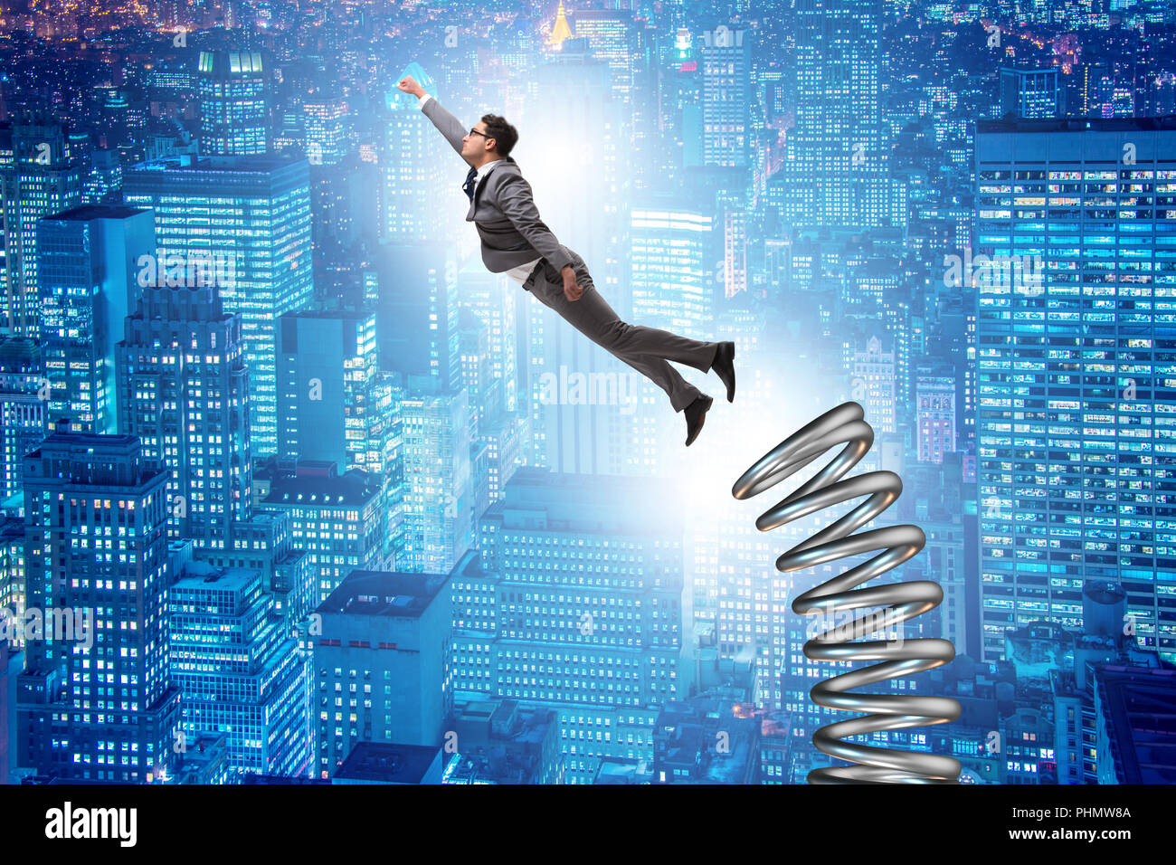 Businessman jumping from spring in promotion concept Stock Photo - Alamy