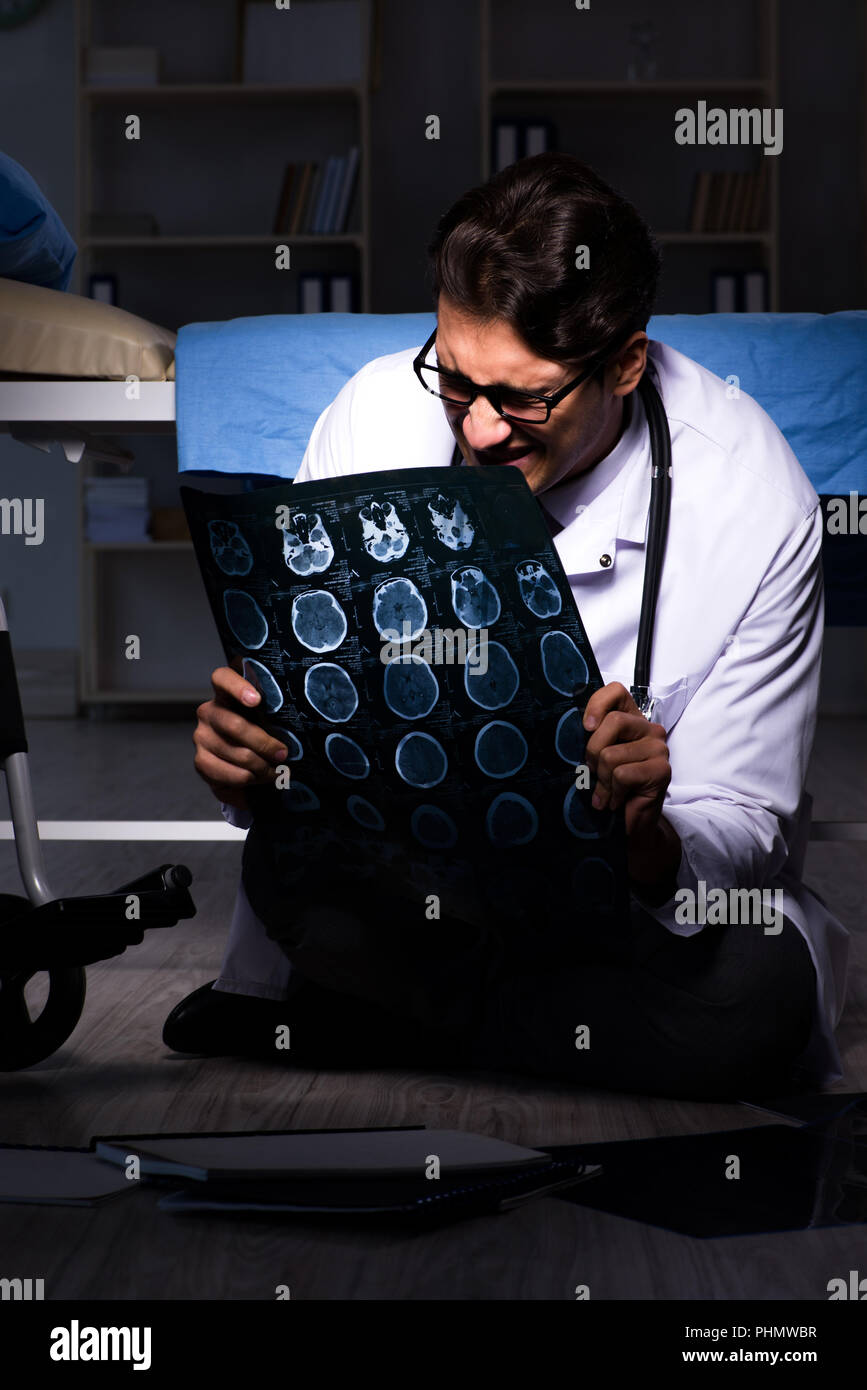 Doctor working night shift in hospital after long hours Stock Photo - Alamy