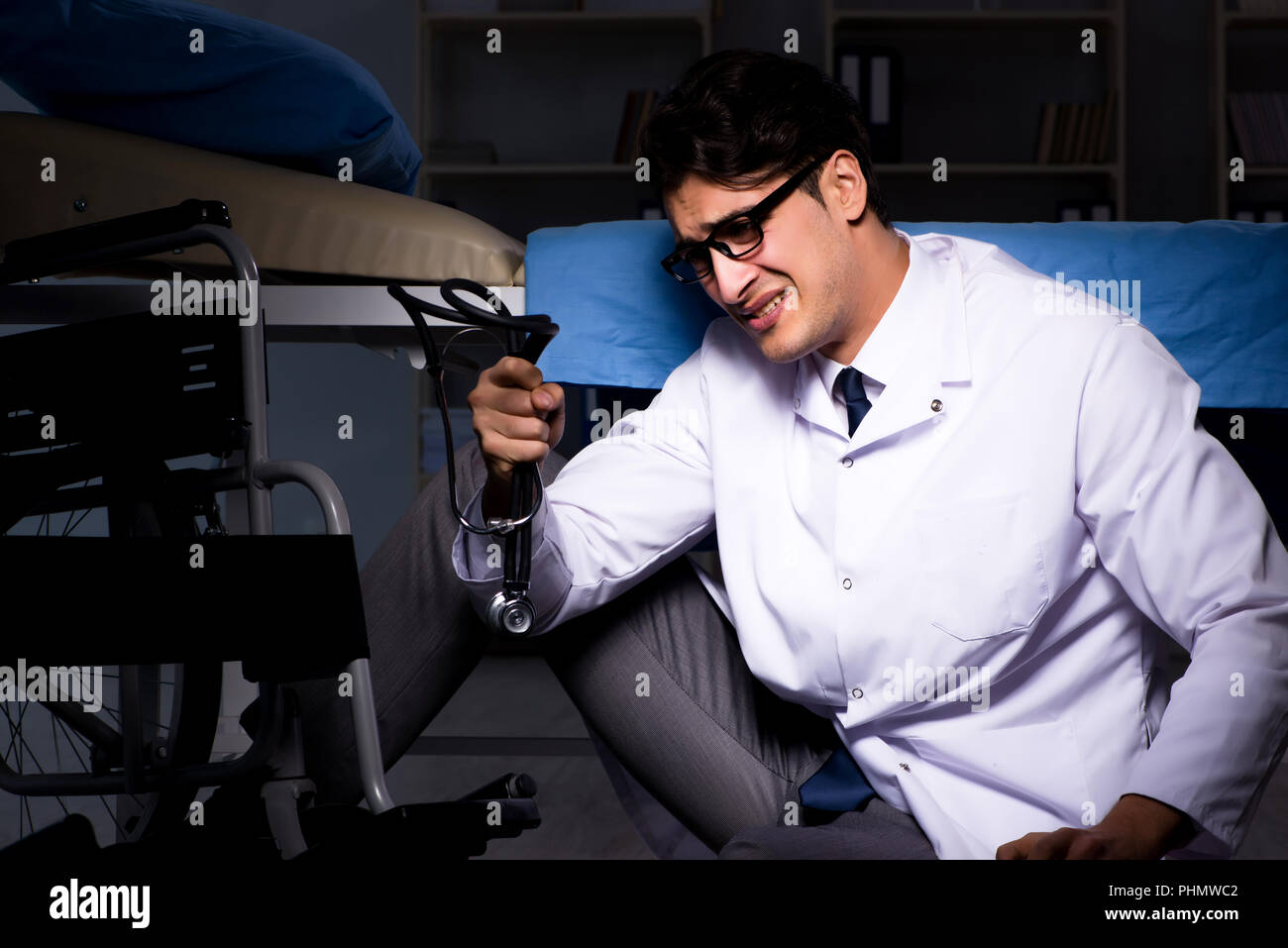 Doctor working night shift in hospital after long hours Stock Photo - Alamy
