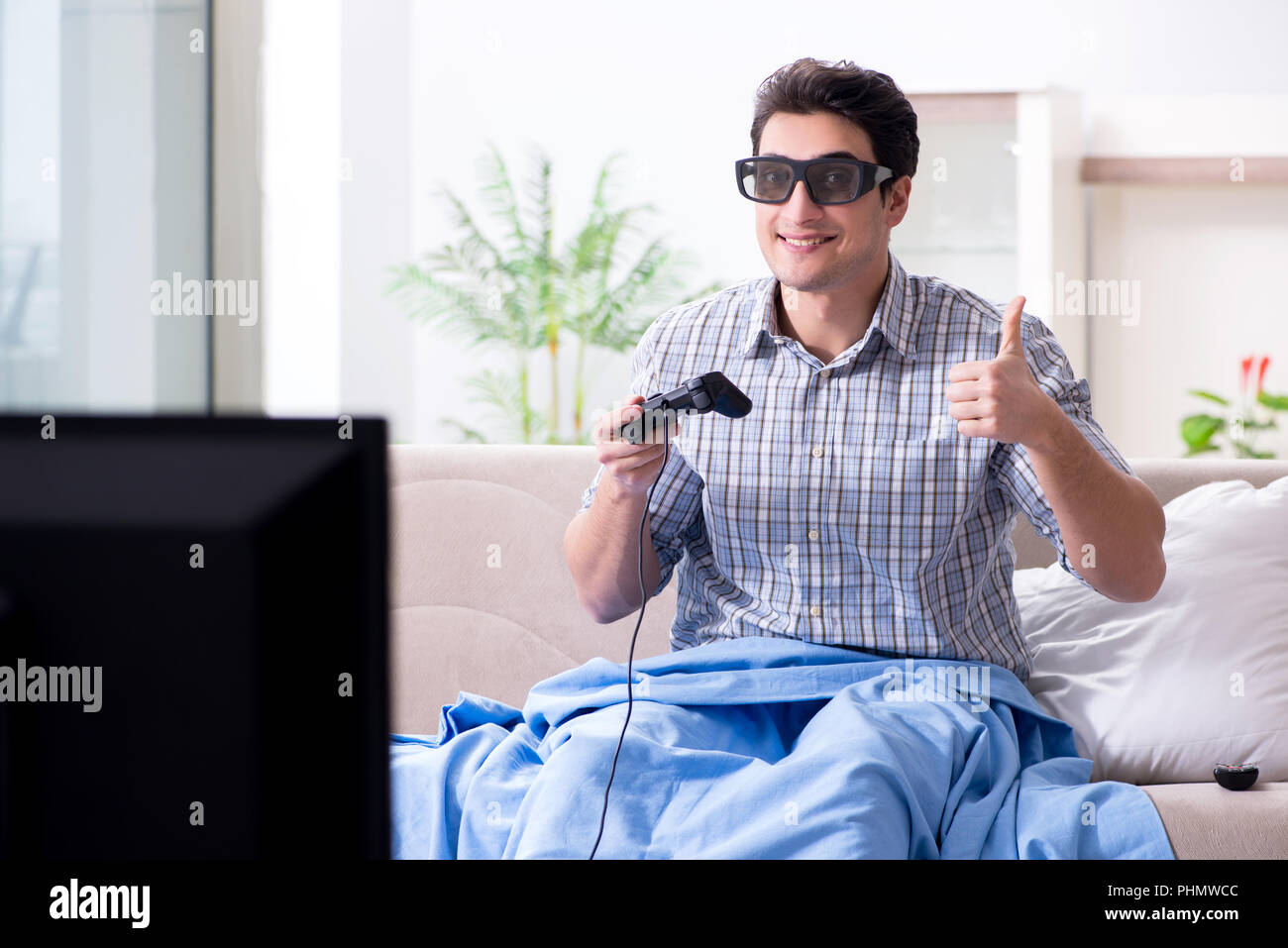 Man playing 3d games at home Stock Photo - Alamy