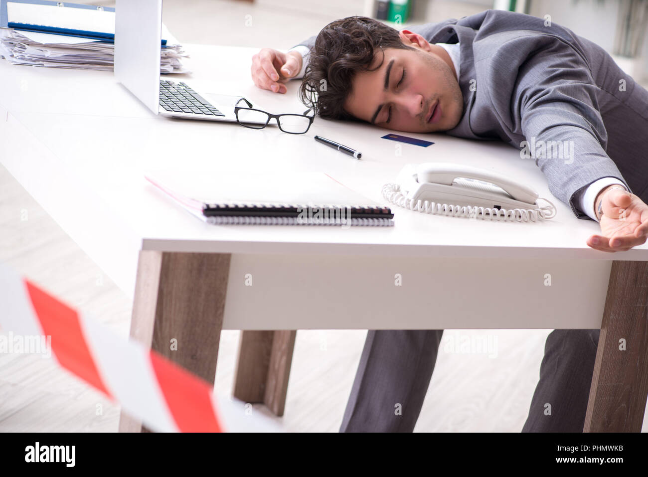 Dead businessman at this desk Stock Photo - Alamy