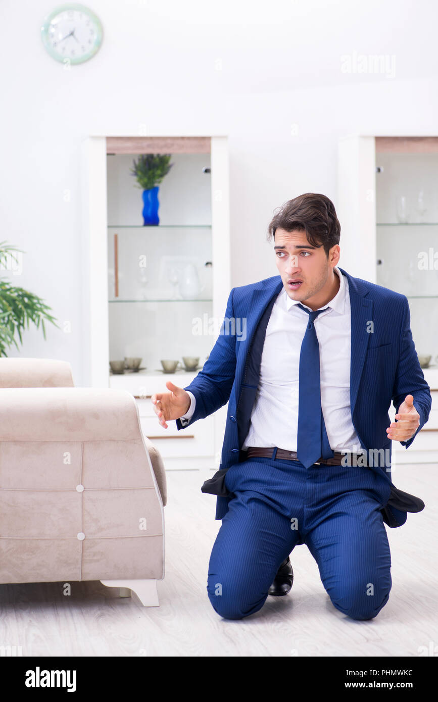 Bankrupt businessman angry and upset at home Stock Photo - Alamy