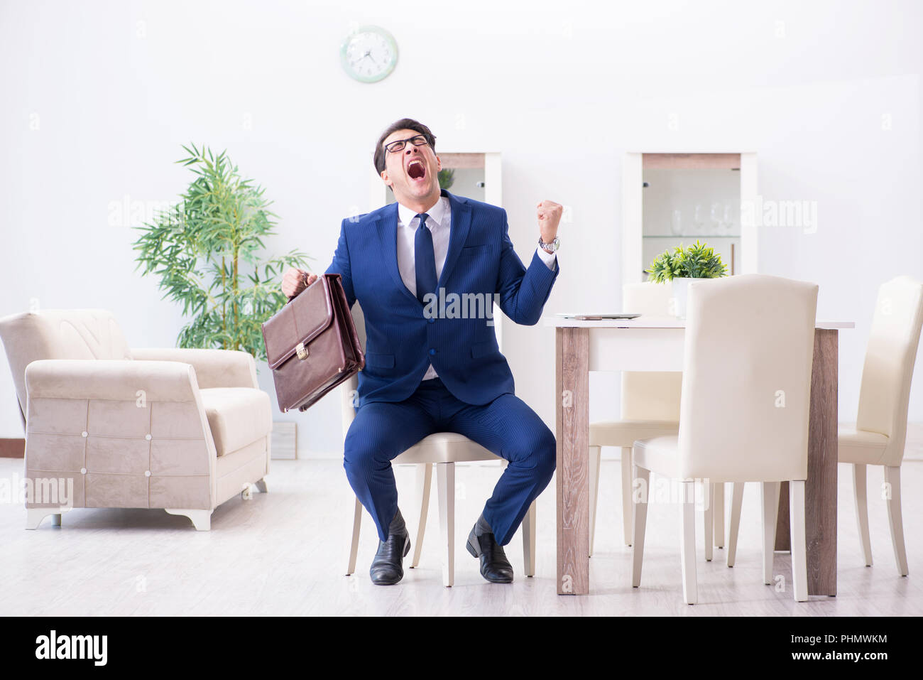 Bankrupt businessman angry and upset at home Stock Photo - Alamy