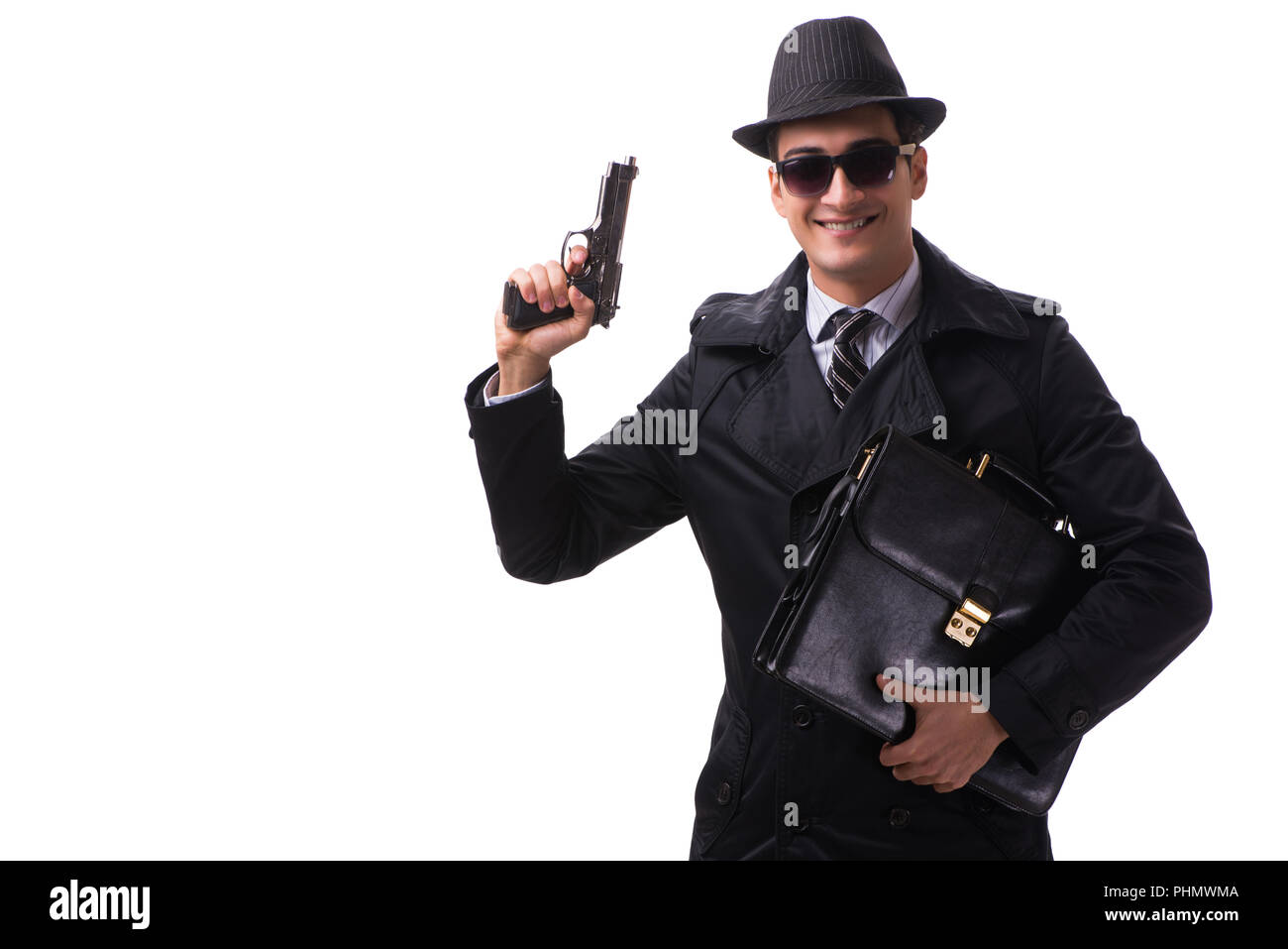 Man spy with handgun isolated on white background Stock Photo - Alamy