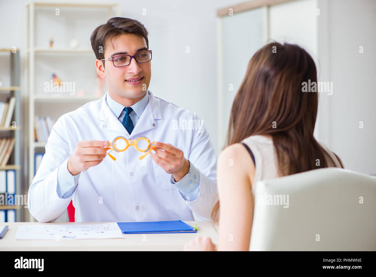 Ophthalmologist is checking up patient in eye doctor hospital Stock ...