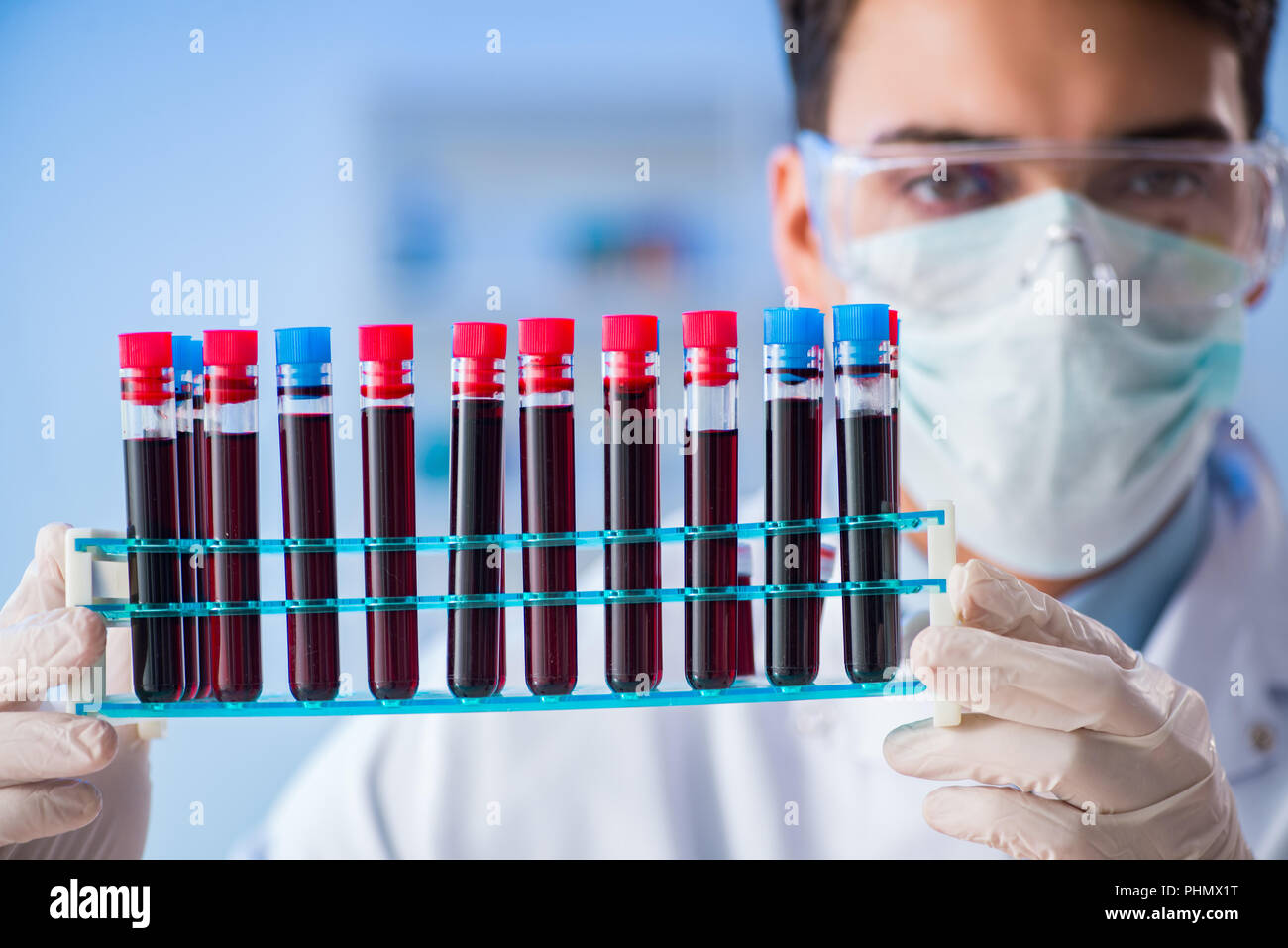 Lab assistant testing blood samples in hospital Stock Photo - Alamy
