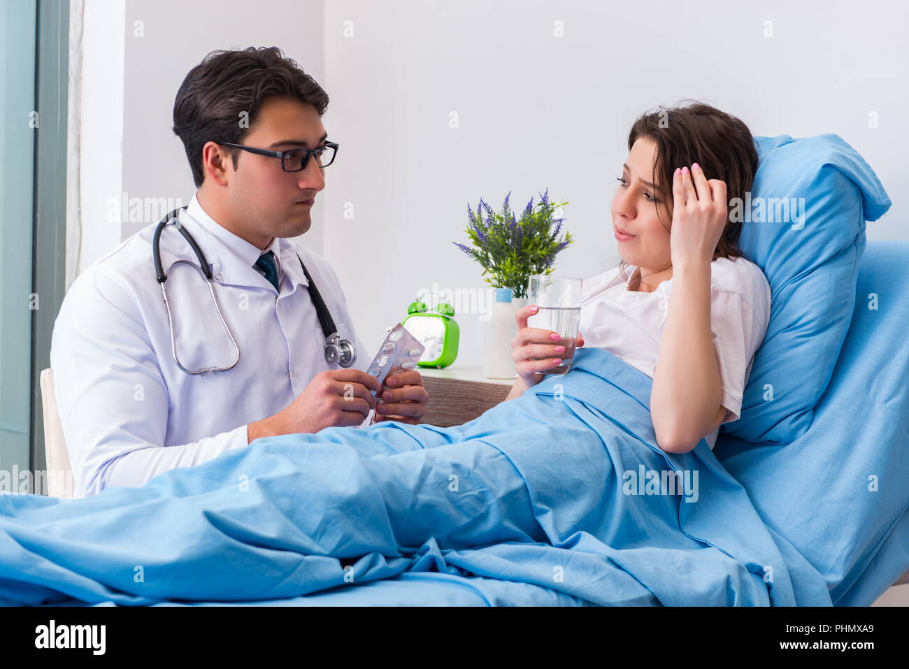 Doctor visiting patient in hospital room Stock Photo - Alamy