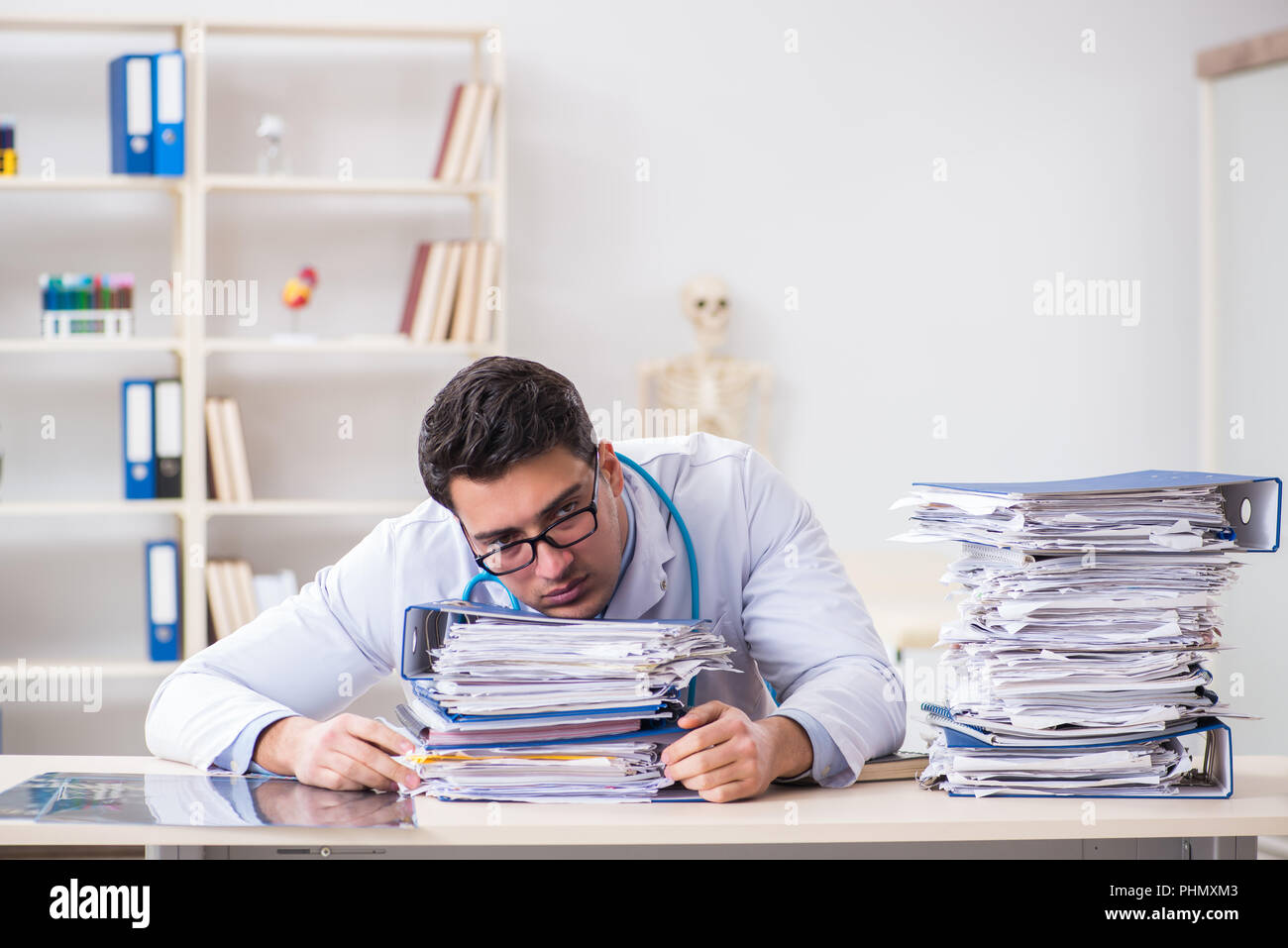 Busy doctor with too much work in hospital Stock Photo - Alamy