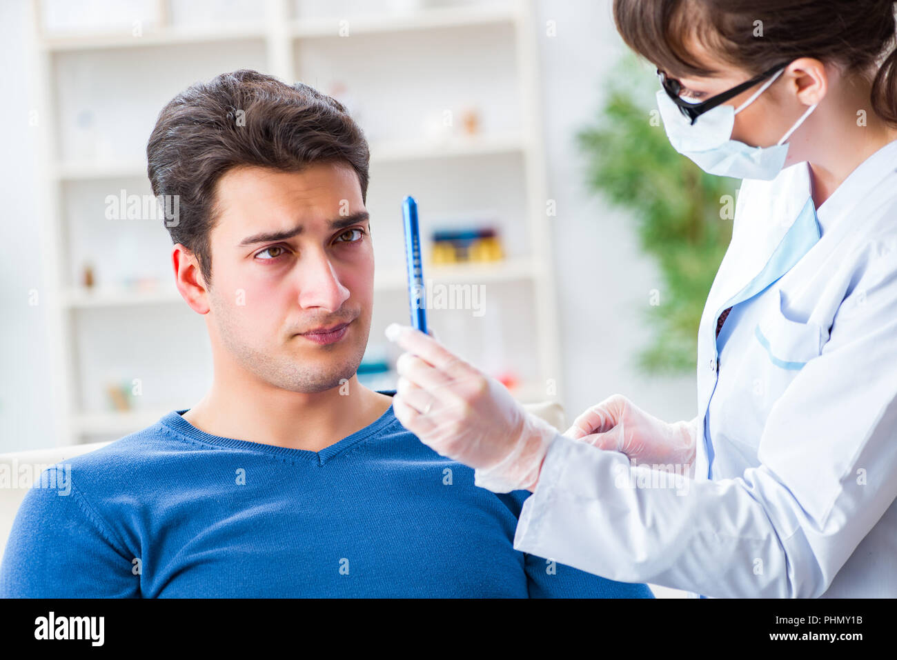 Doctor checking up patient in first aid concept Stock Photo - Alamy