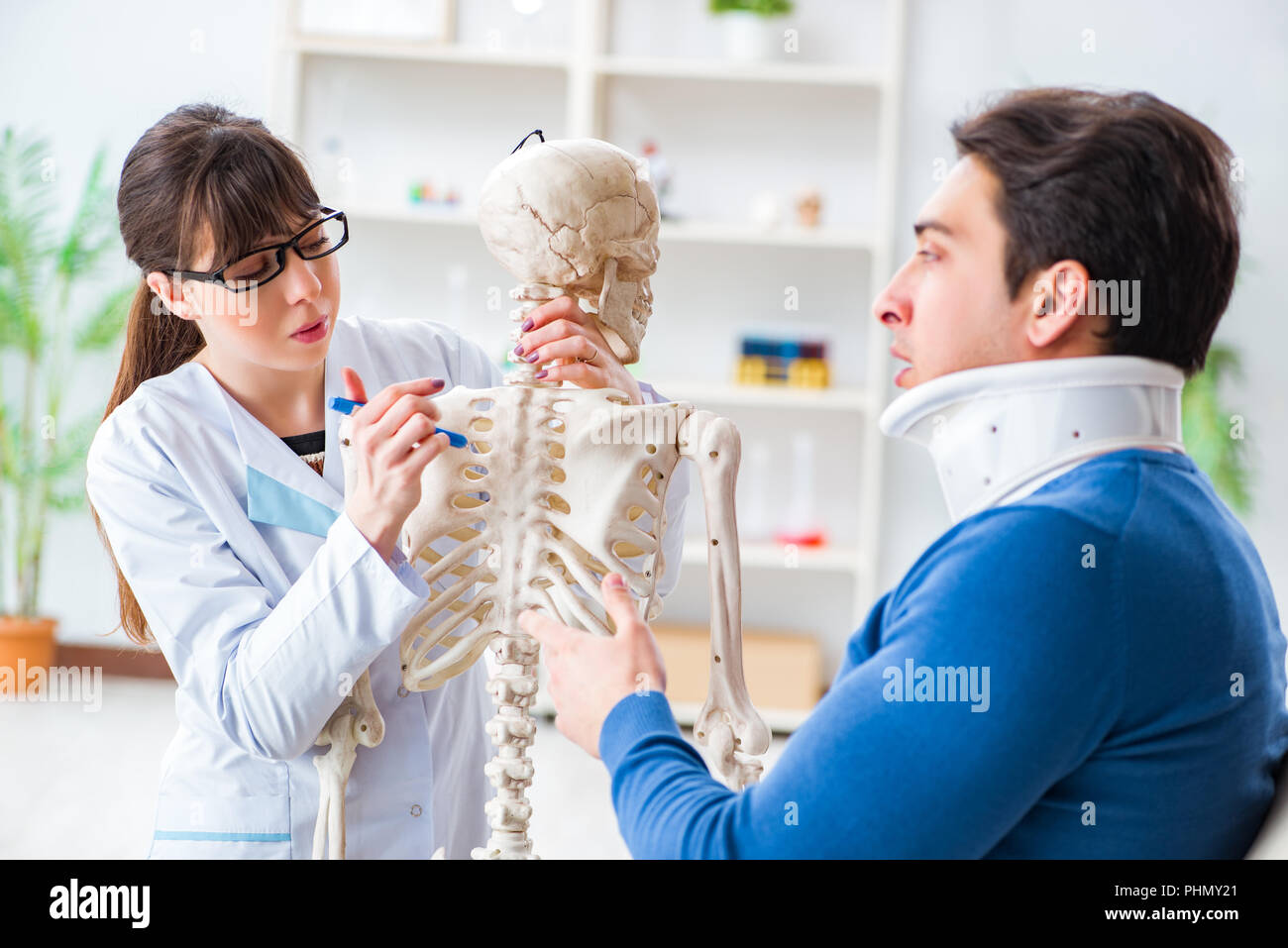 Doctor is explaining to patient with neck injury Stock Photo - Alamy