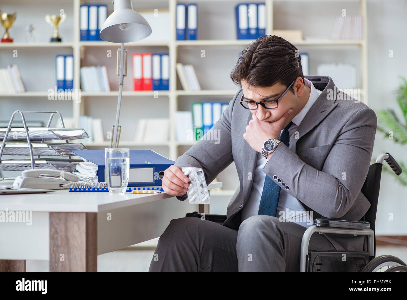 Disabled businessman working in the office Stock Photo - Alamy
