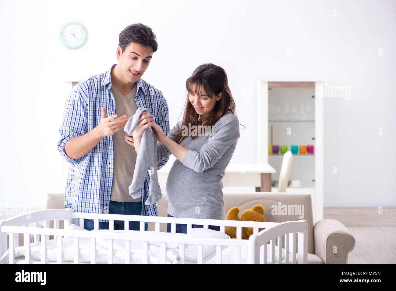 Young parents expecting their first baby Stock Photo - Alamy