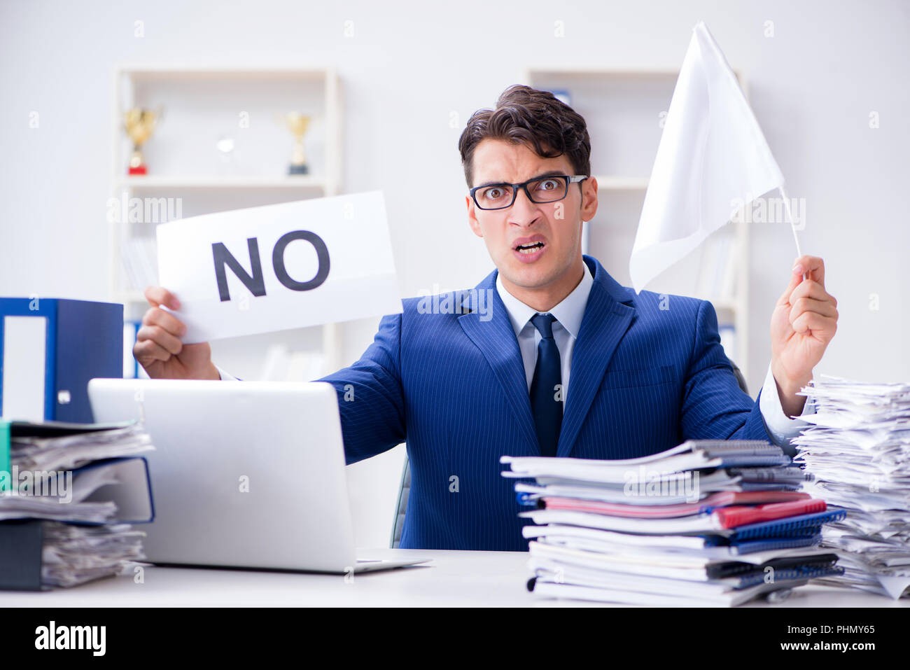Businessman throwing white flag and giving up Stock Photo - Alamy