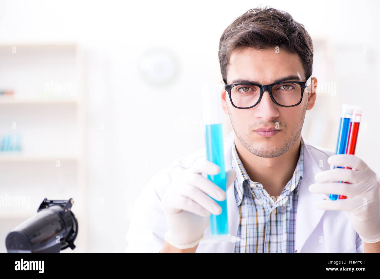 Chemistry student doing chemical experiments at classroom activi Stock ...