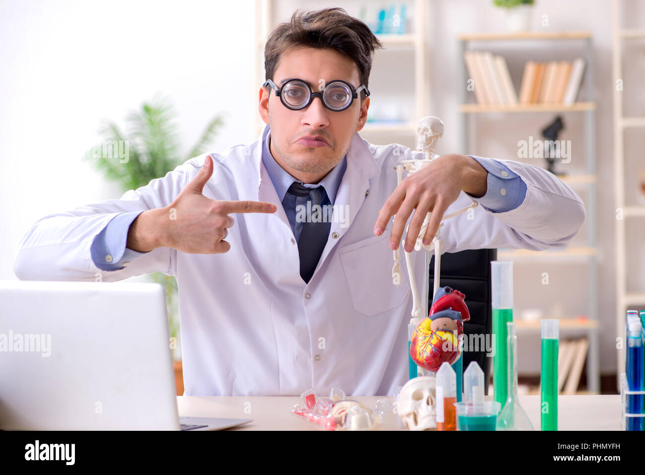 Funny doctor having fun in hospital lab Stock Photo - Alamy