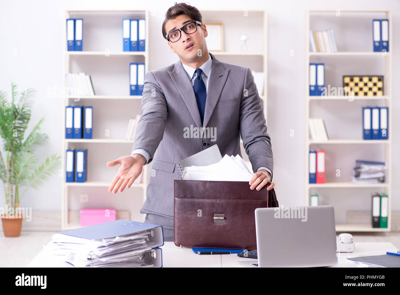 Employee with too much work taking it home Stock Photo - Alamy