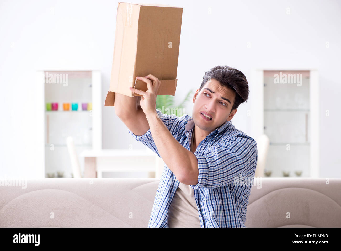 Man receiving empty parcel with stolen goods Stock Photo - Alamy