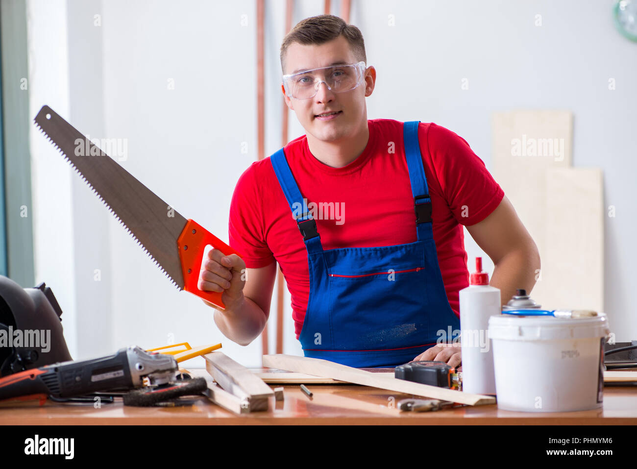 Contractor working in the workshop Stock Photo - Alamy