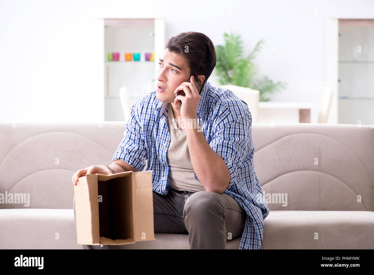Man receiving empty parcel with stolen goods Stock Photo - Alamy