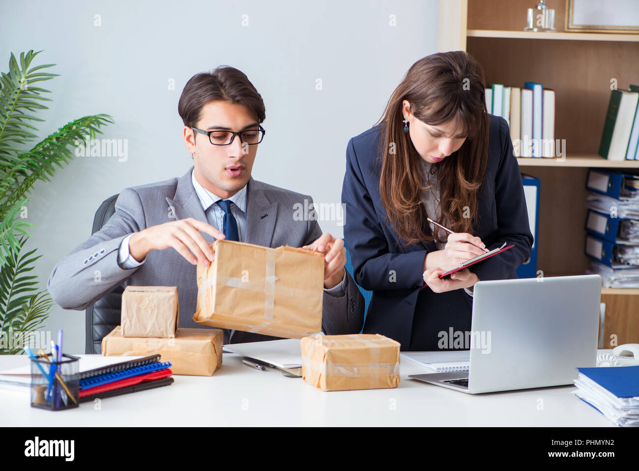 Business people receiving new mail and parcels Stock Photo - Alamy