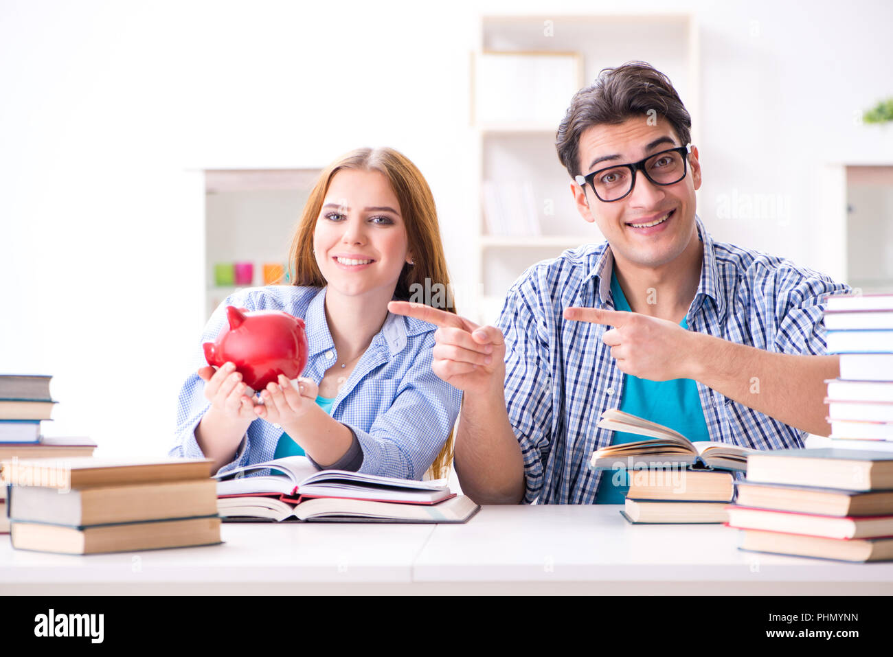 Two students checking savings to pay for education Stock Photo - Alamy