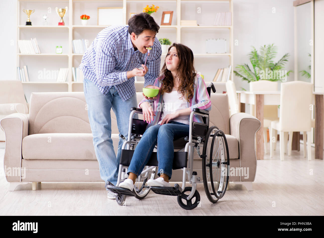 Young family taking care of each other Stock Photo - Alamy