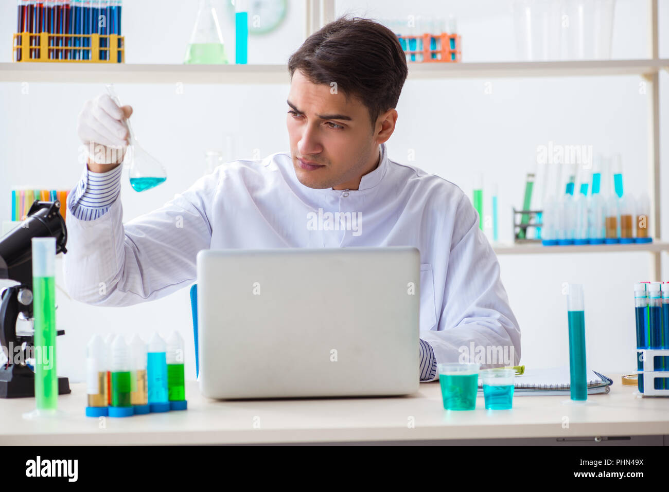 Man student working in chemical lab on experiment Stock Photo - Alamy