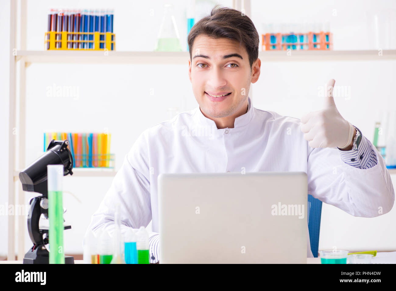 Man student working in chemical lab on experiment Stock Photo - Alamy
