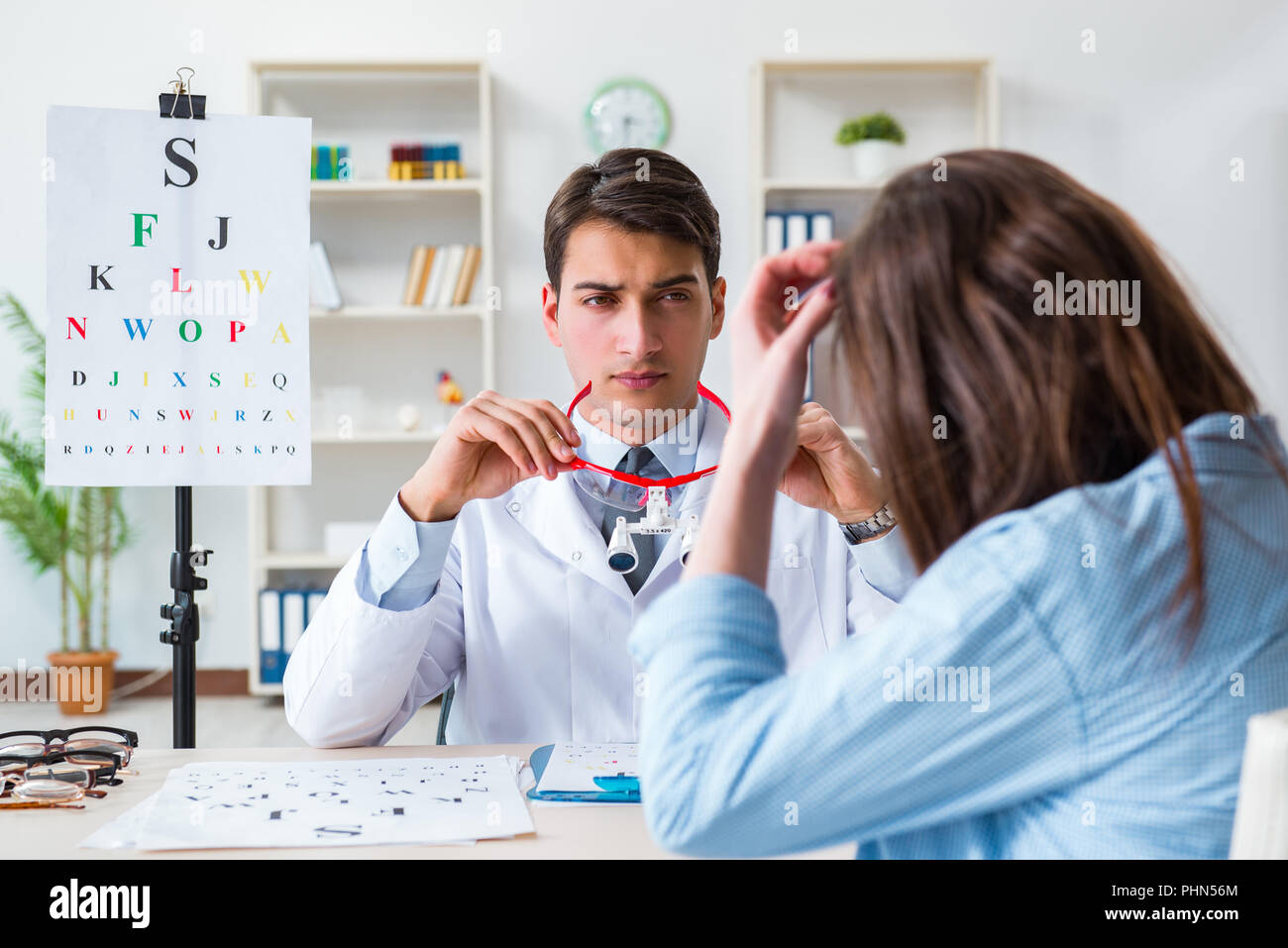 Doctor with patient at eye exam Stock Photo - Alamy
